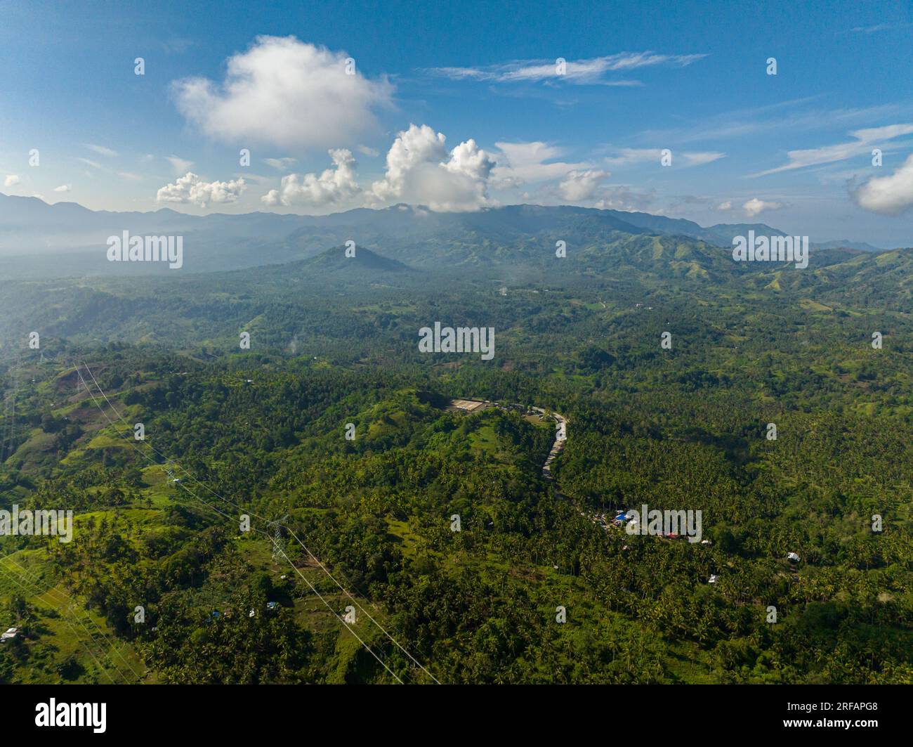 Mountain landscape: Mountain slopes covered with rainforest and jungle ...