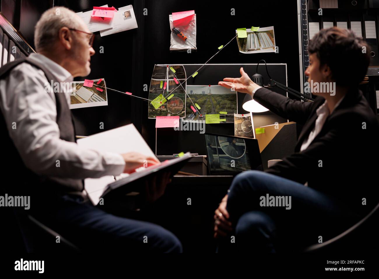 Senior private detective analyzing missing person case, discussing ...