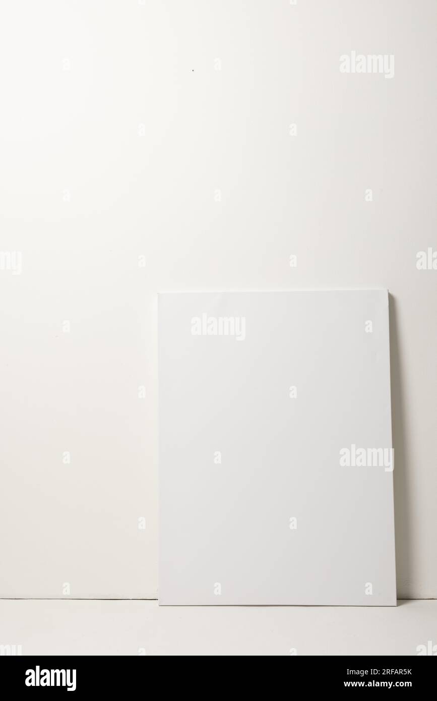 White canvas and copy space leaning against white wall background Stock ...