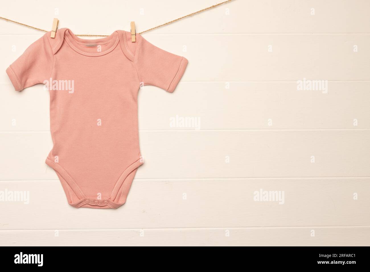 Pink baby grow hi-res stock photography and images - Alamy