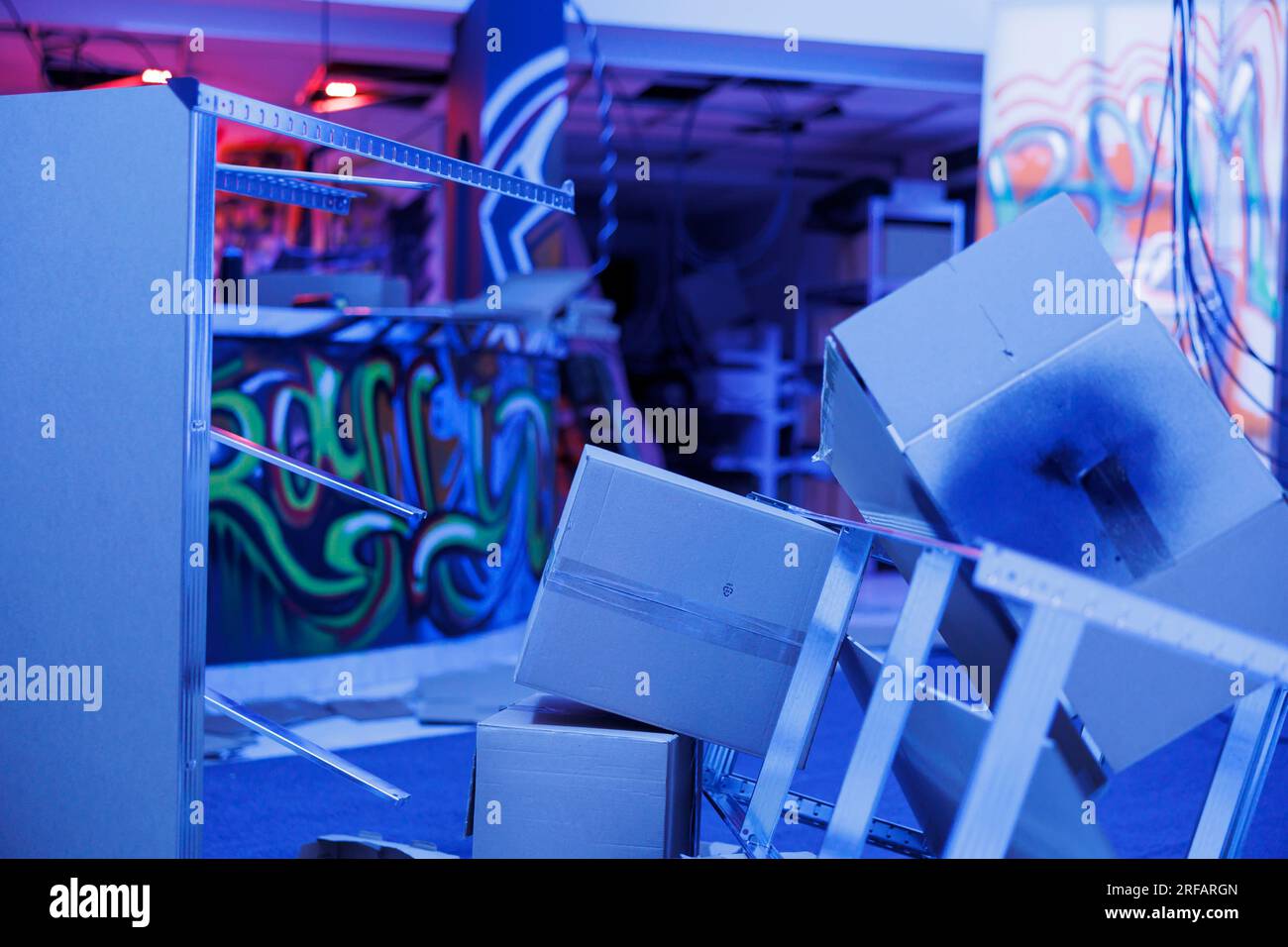 Abandoned rusty building with purple neon lights in state of ruins ...