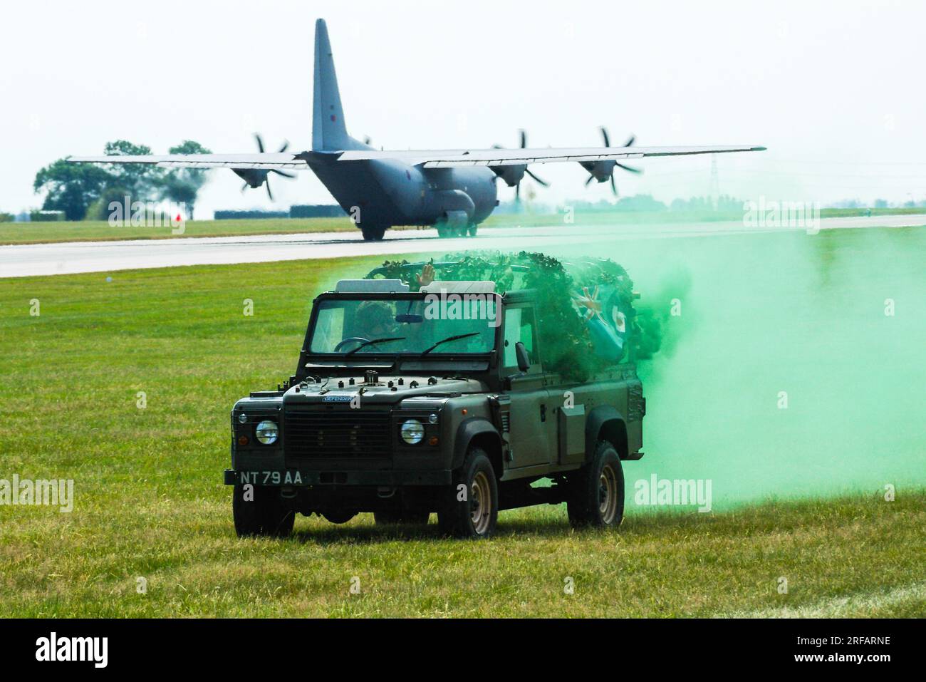 Role demonstration by British Armed Forces. Military Land Rover laying ...
