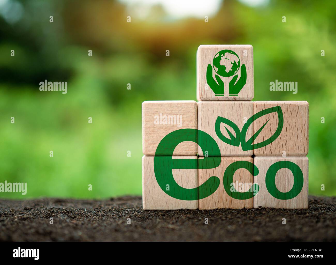 Wooden sticks stacked with ECO concept lettering on nature background ...