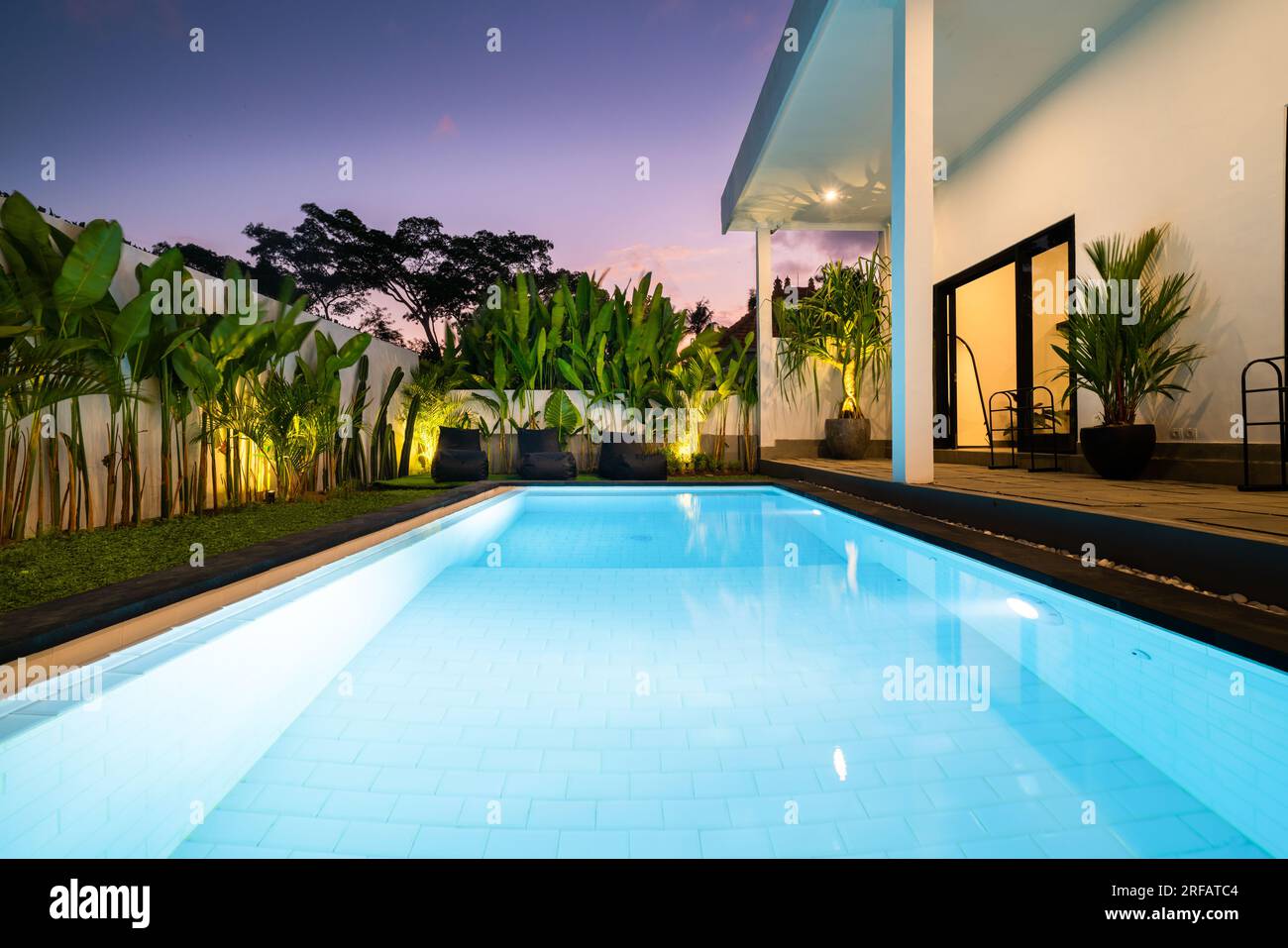 Tropical villa view with garden, swimming pool and open living room at ...