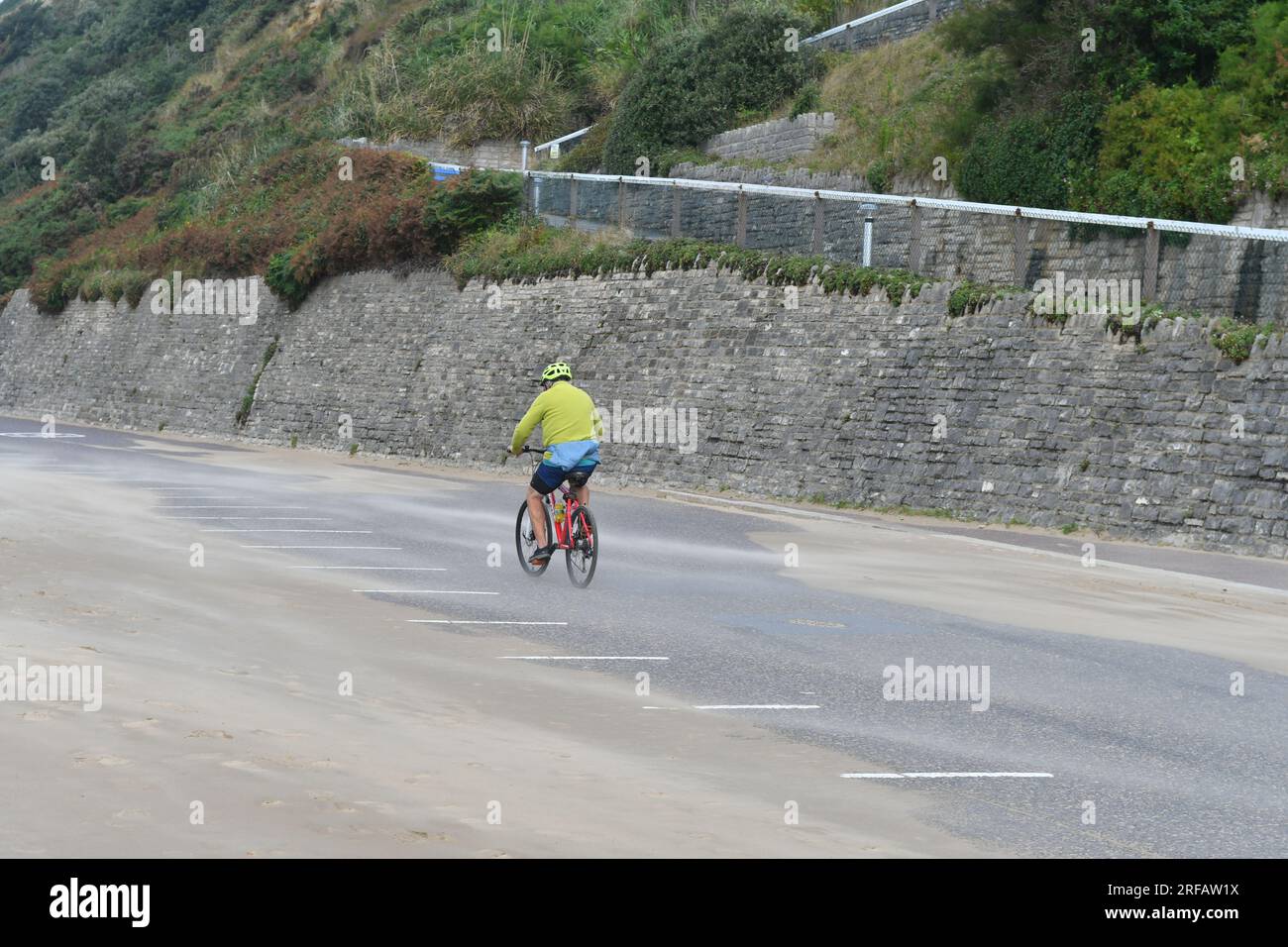 Cyclist in windy weather hi-res stock photography and images - Alamy