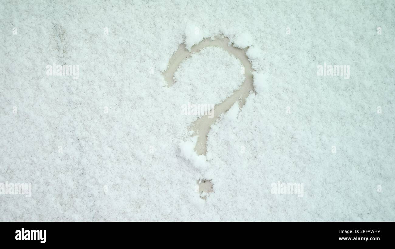 Question mark painted on white snow closeup Stock Photo - Alamy