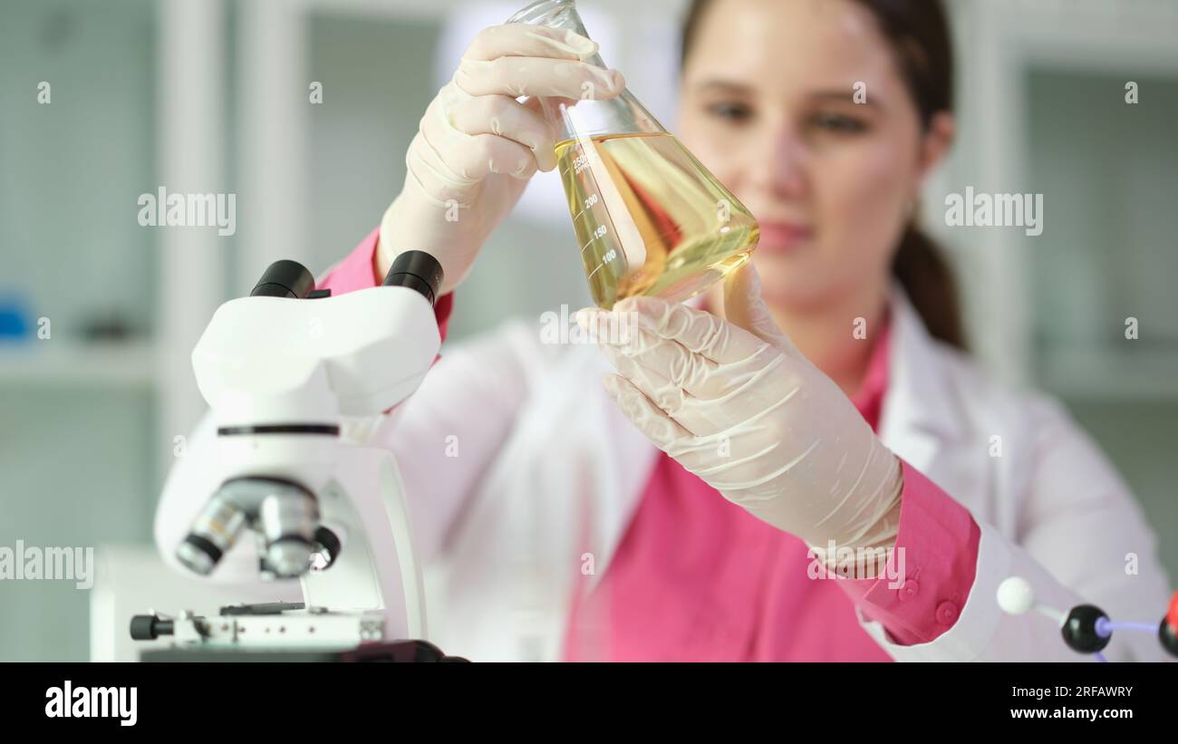 Doctor researcher holding tube hi-res stock photography and images - Alamy