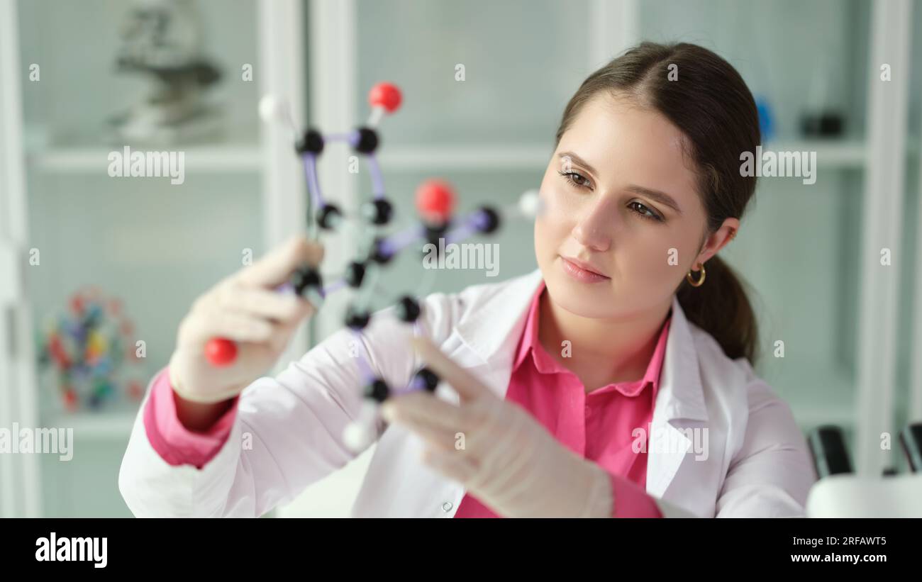 Scientist holding a molecule model hi-res stock photography and images ...