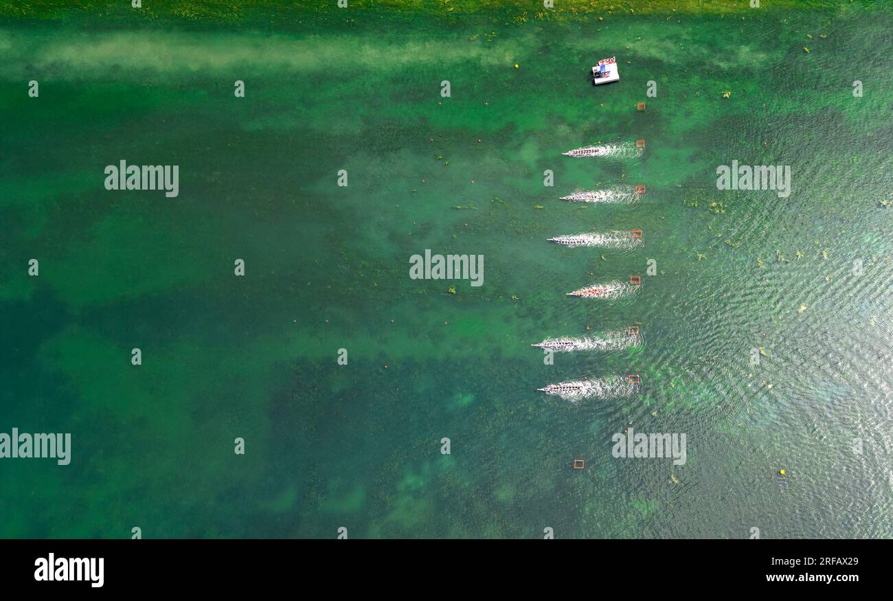 Aerial photo of colourful sports canoes at a competition, taken from ...