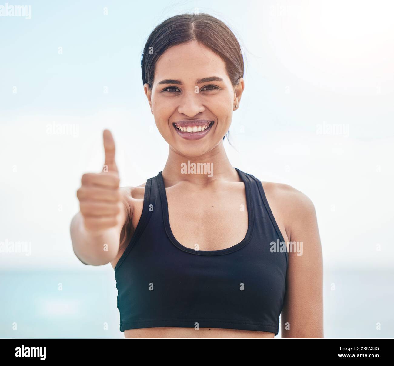 Woman portrait, fitness and thumbs up at a beach with thank you ...