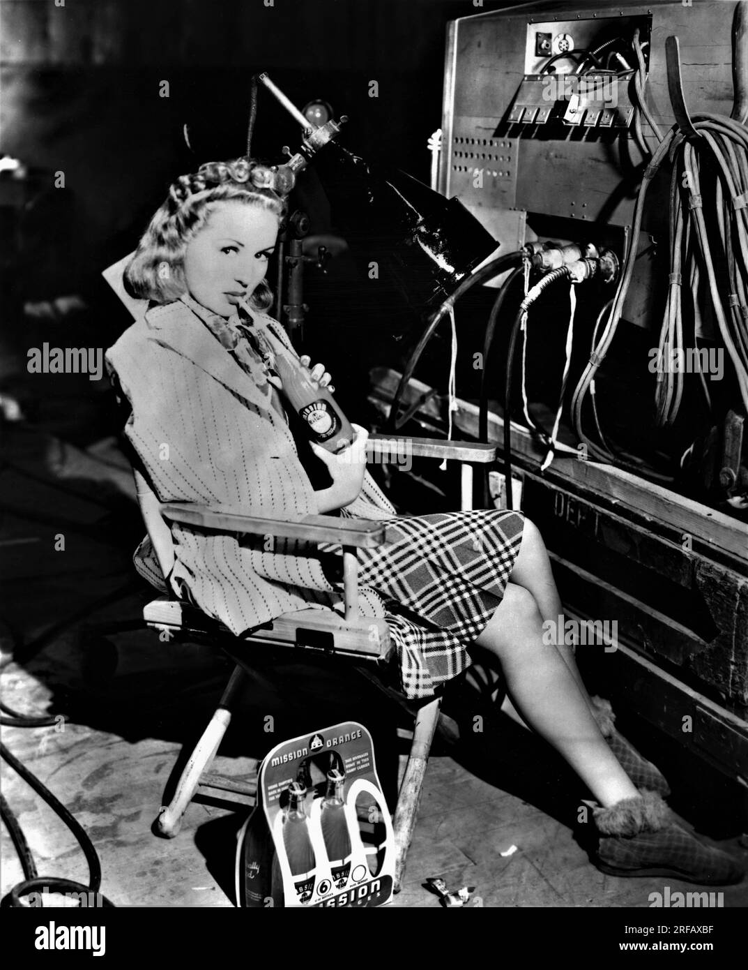 BETTY GRABLE circa 1938 on set candid drinking orange juice publicity ...