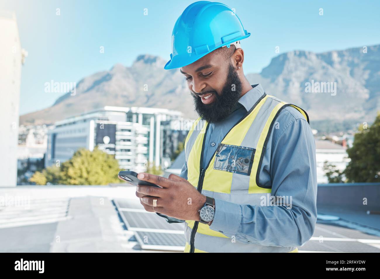 Engineering man, solar panels and phone in energy saving ...