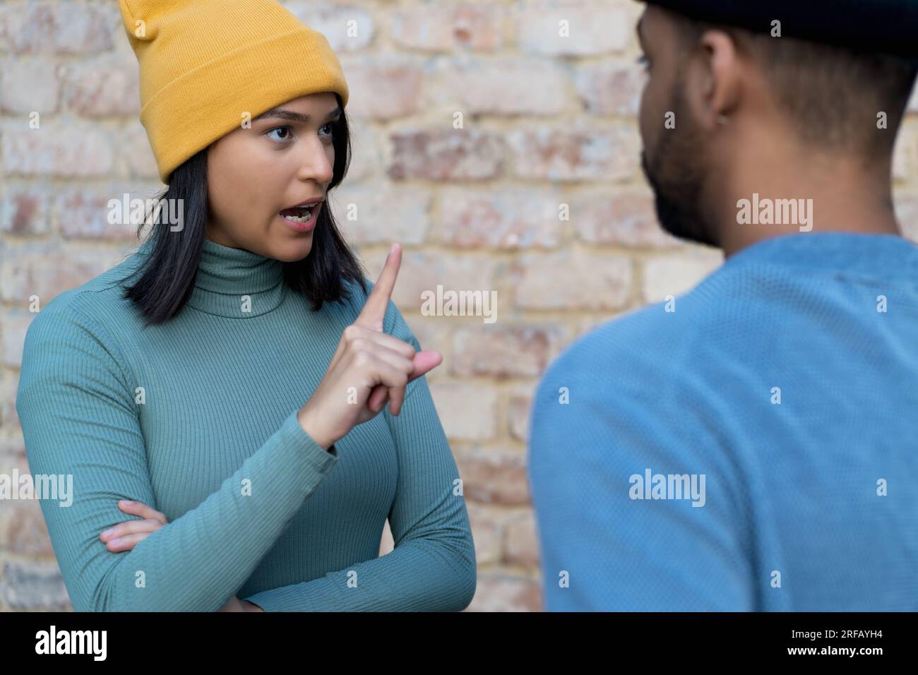 Latin american hipster woman in discussion with boyfriend outdoor in ...