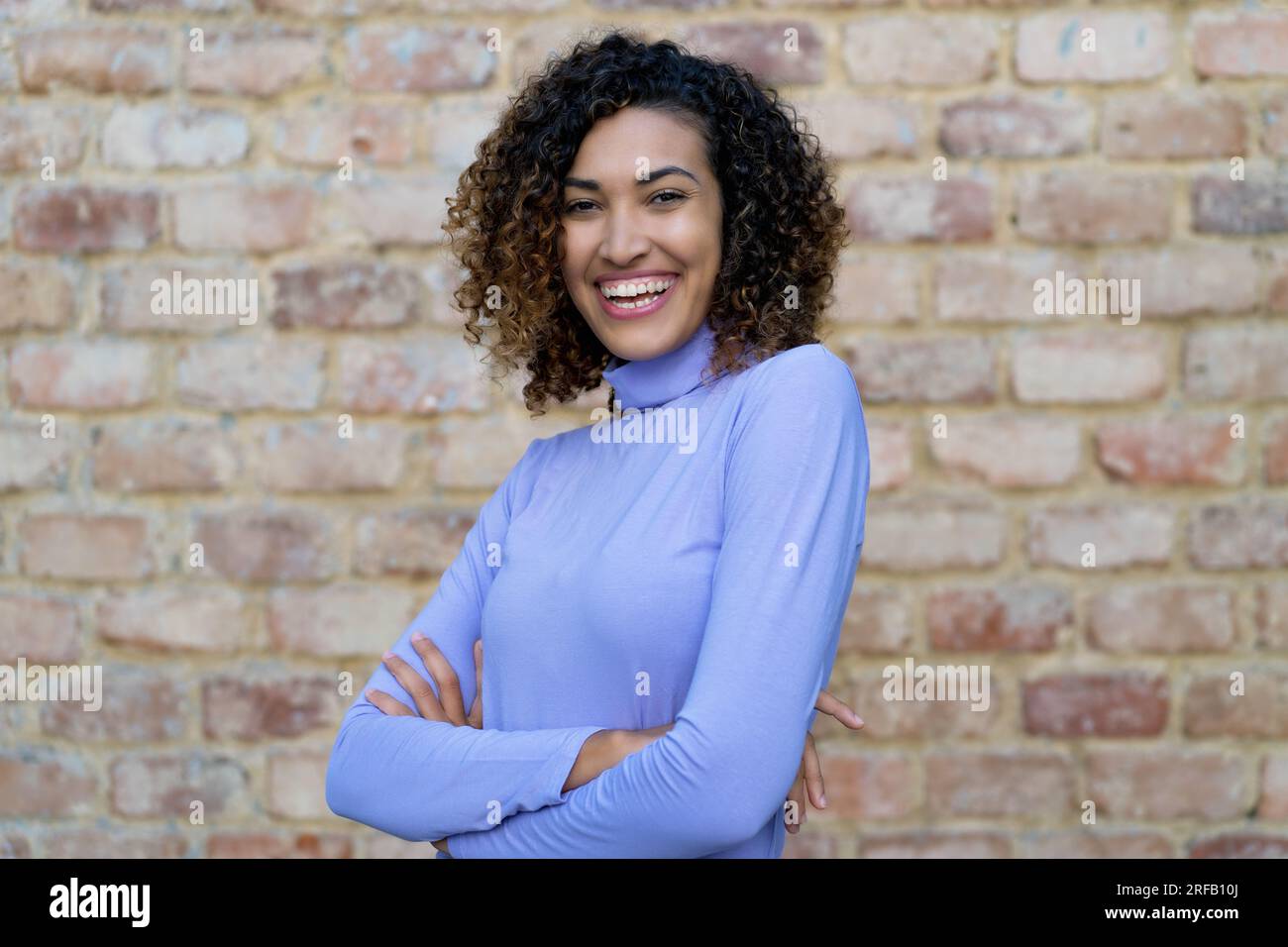 Portrait of mexican woman with curly hair in urban style Stock Photo ...