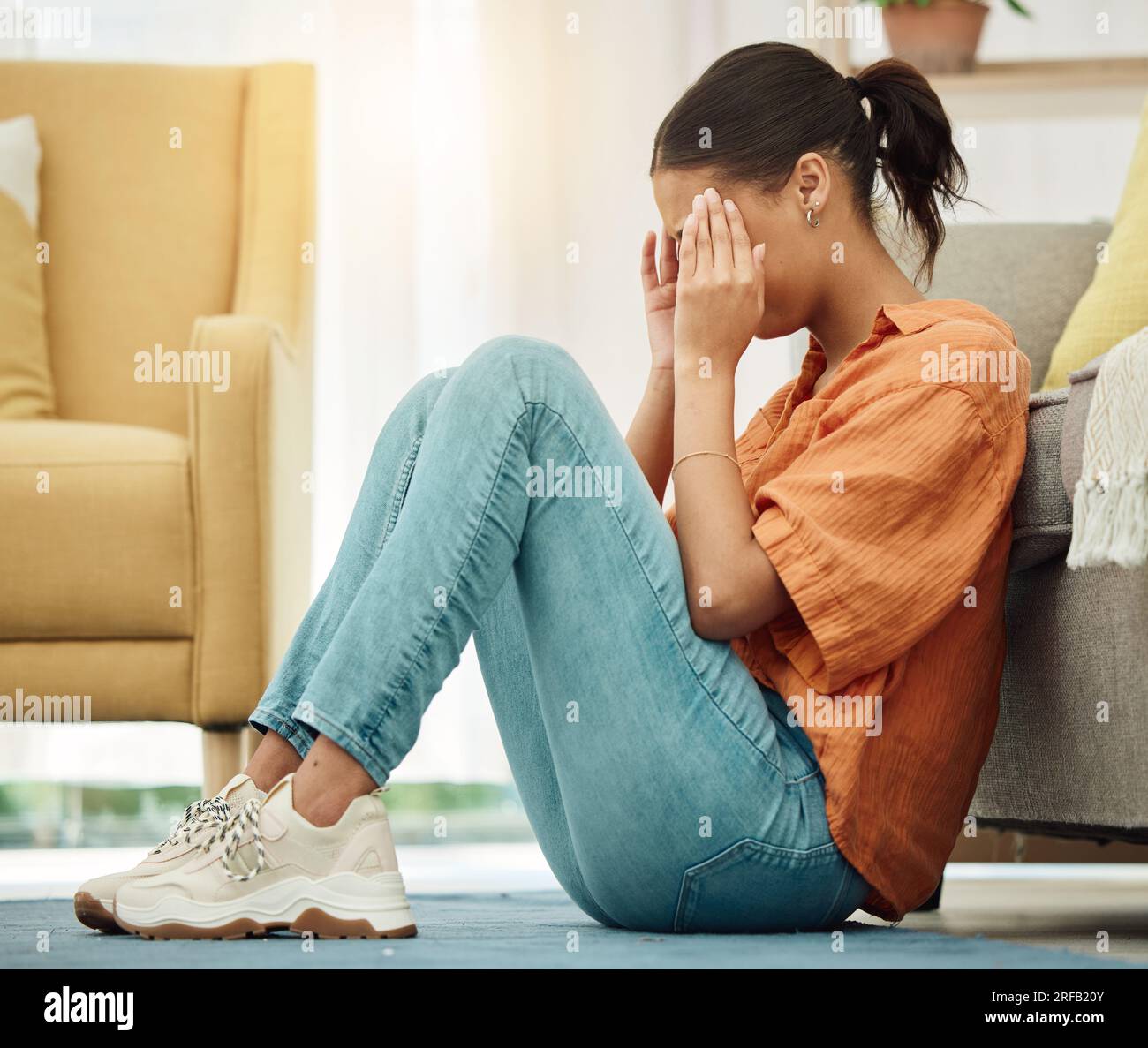 Headache, woman and stress on floor of home with anxiety, depression or ...