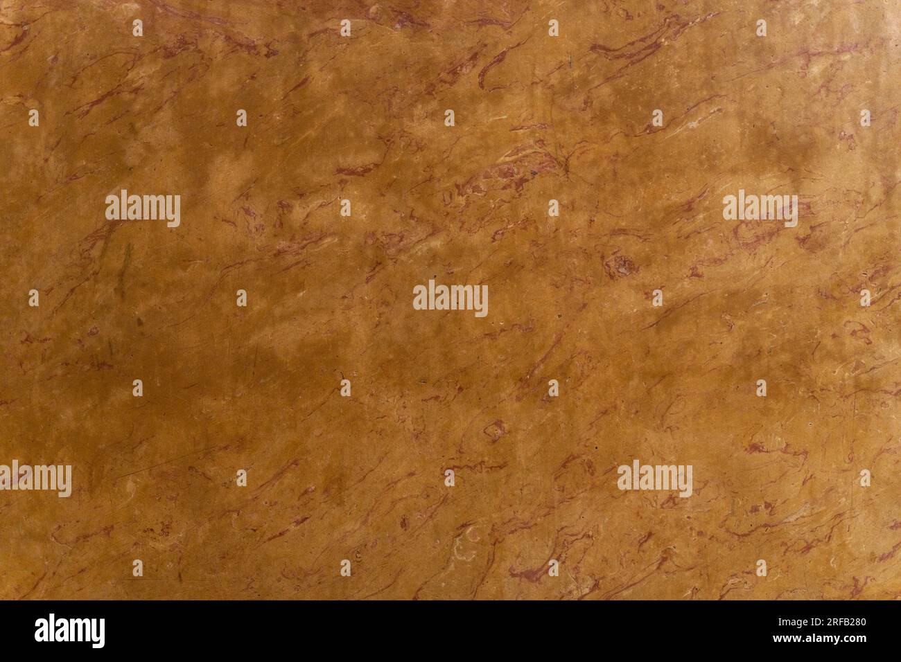 The texture of a smooth surface of a brown-red stone with a pattern ...