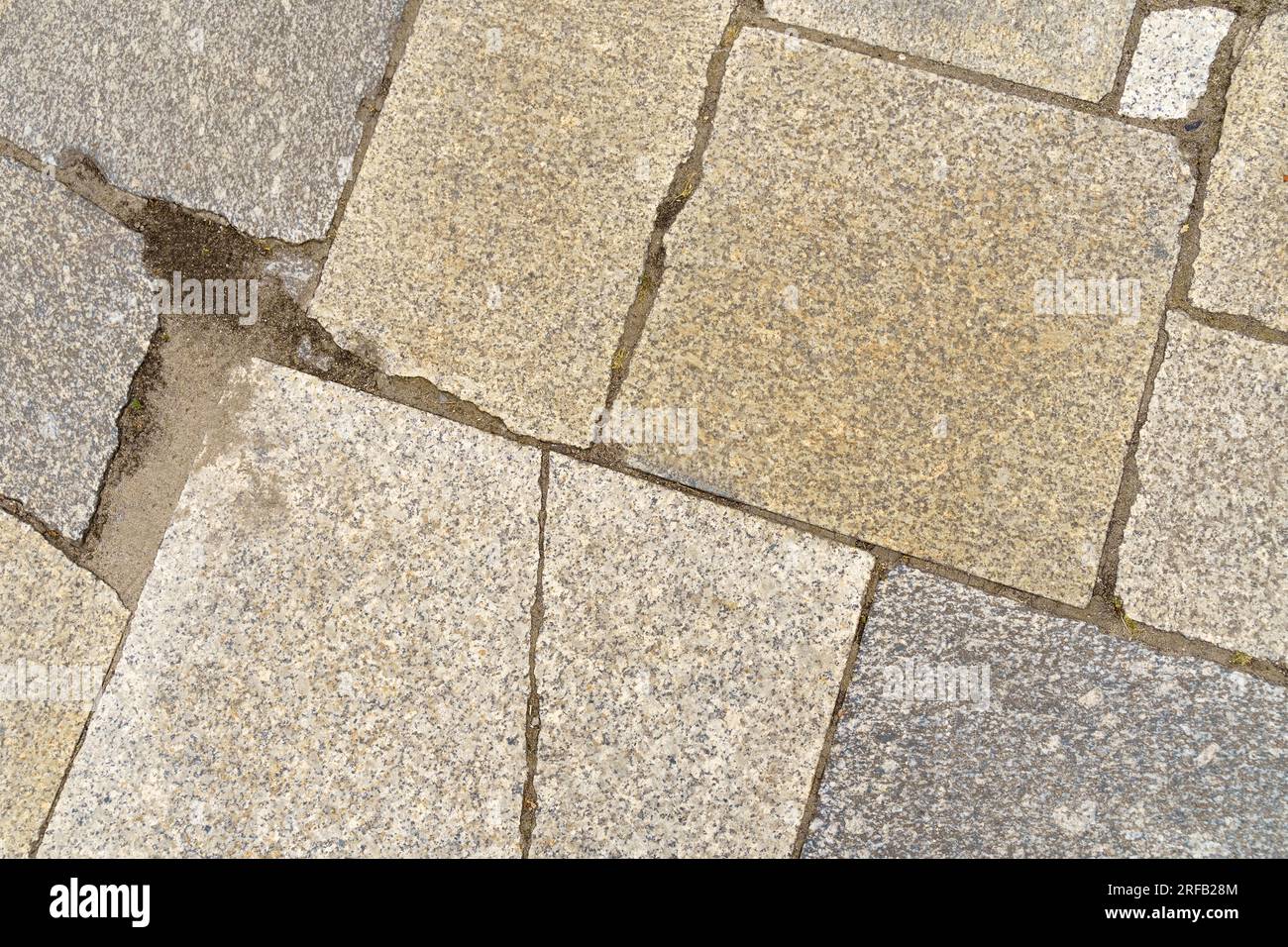 Texture of old cracked gray granite paving slabs Stock Photo - Alamy