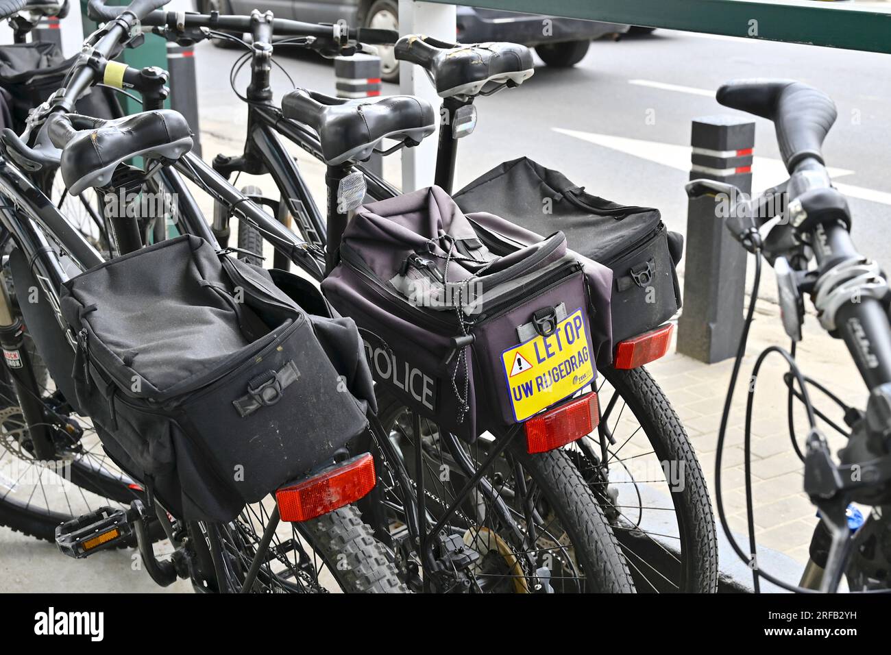Parked police service bicycles in the center of Paramaribo. One with ...