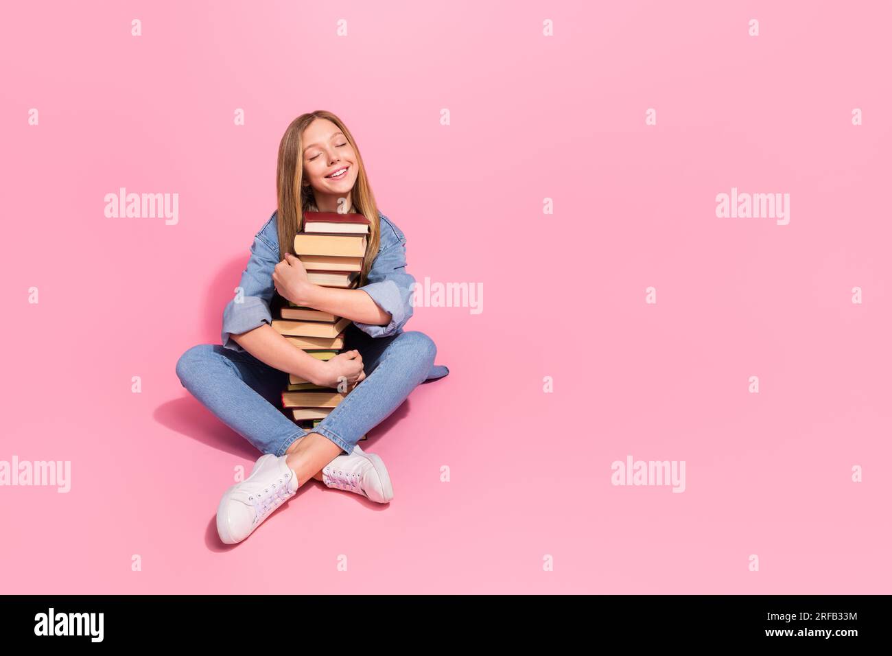 Photo of lovely dreamy satisfied girl wear stylish denim clothes hug ...