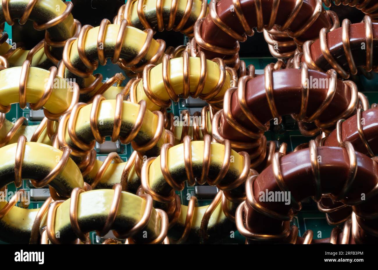 A pattern of toroidal inductors on an electronic circuit board Stock ...