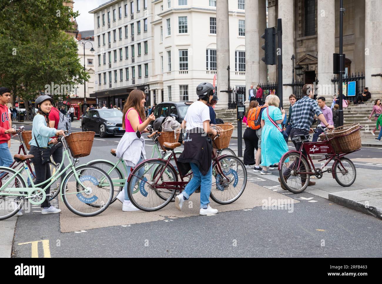 Cyclists cross the Road at a crossing point near Trafalgar Square in ...
