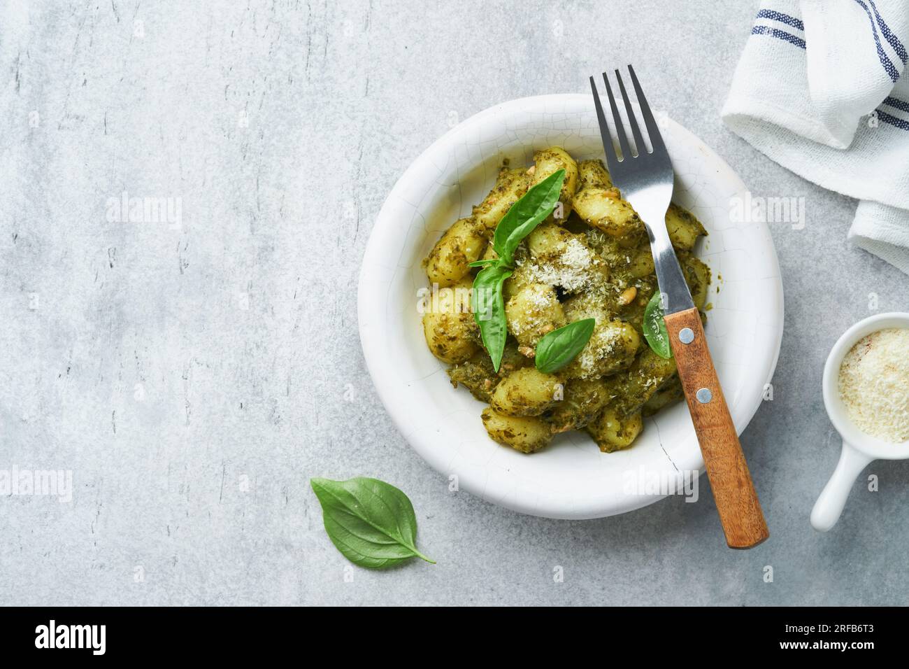 Traditional homemade gnocchi in the plate on wooden background Stock ...