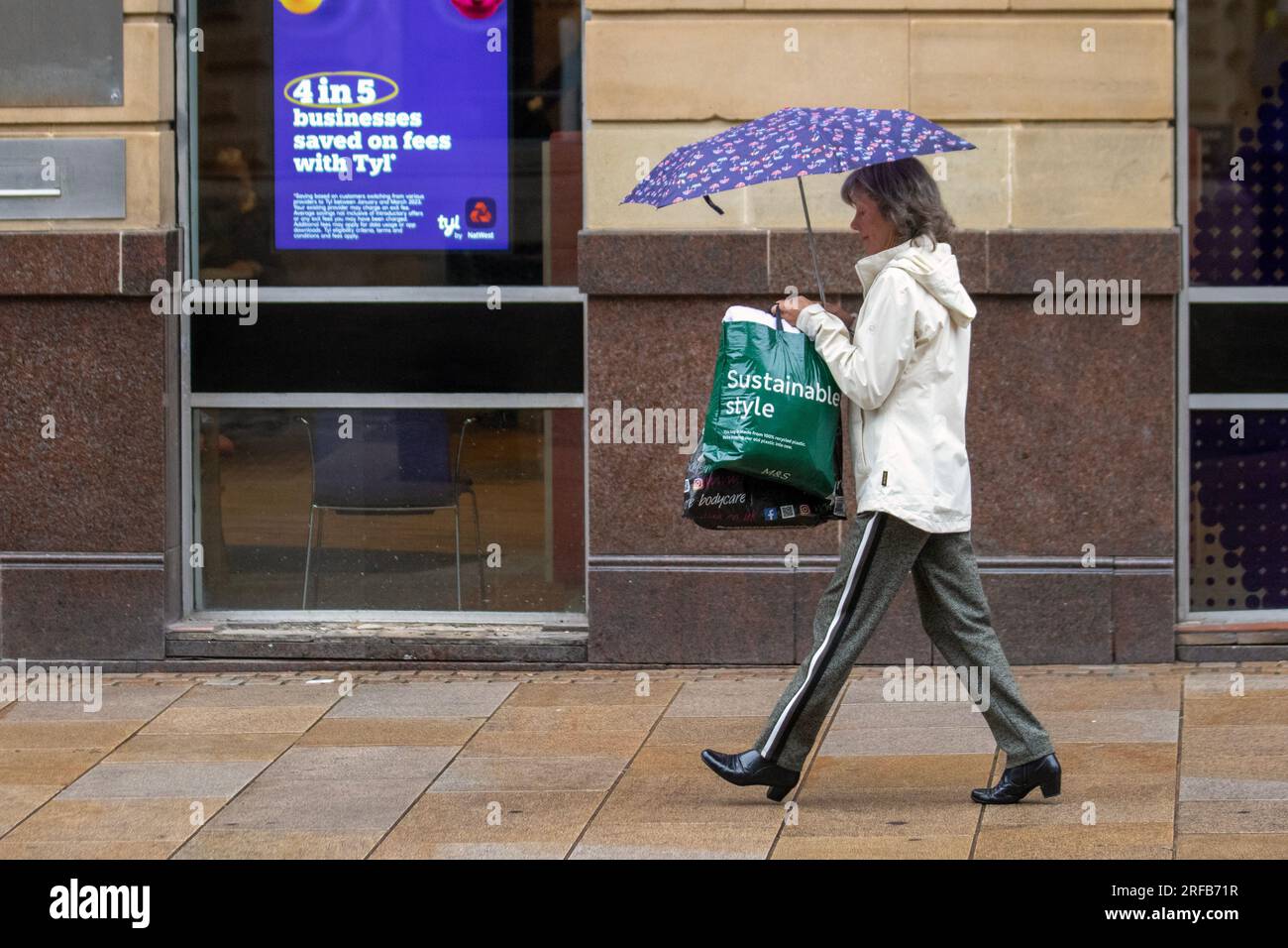 Shopper passing Nat West Bank Fishergate Preston, Lancashire. UK ...