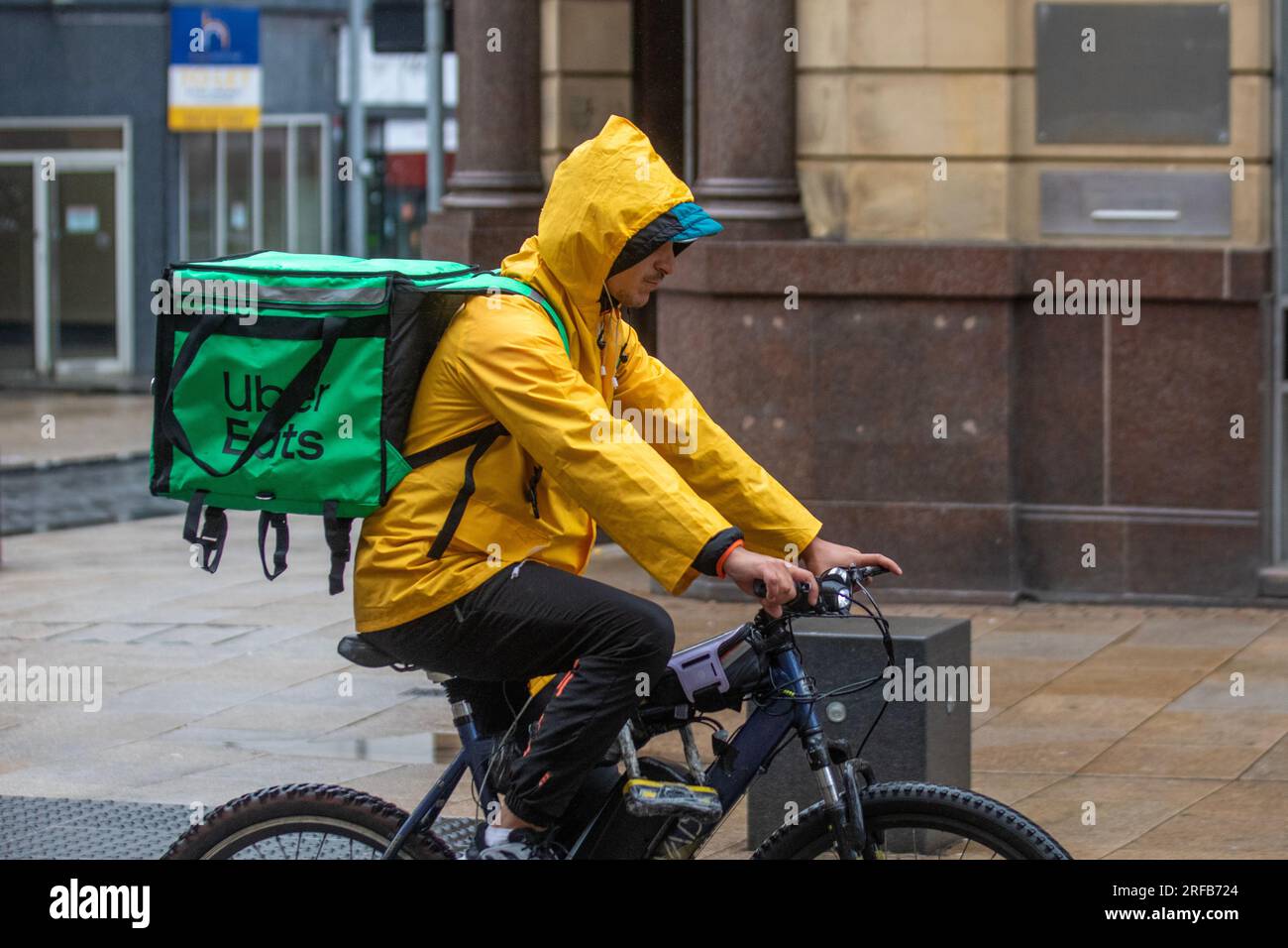 Uber Eats bicycle delivery in Preston, Lancashire. 02 Aug 2023. . Shops ...