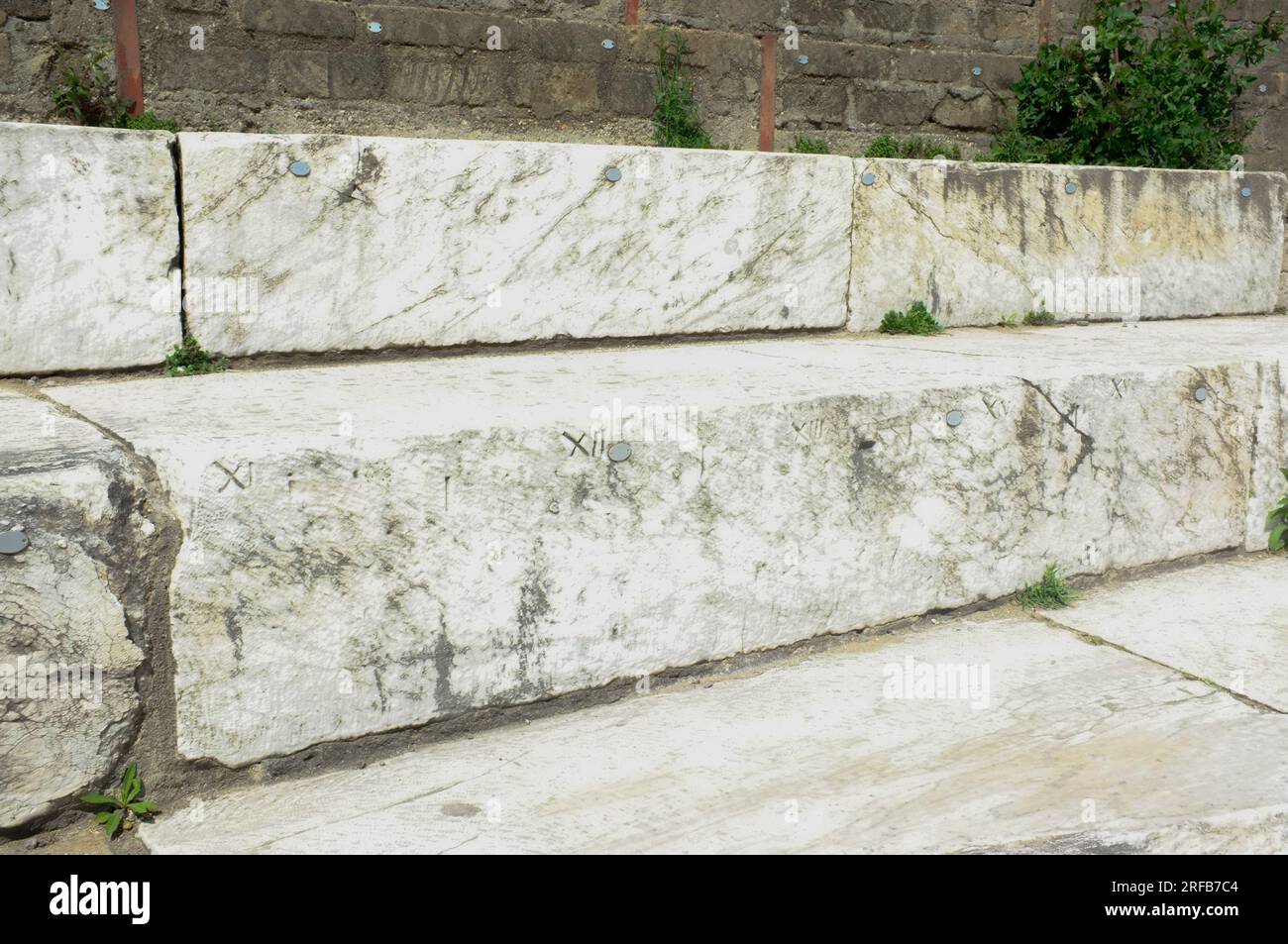 roman numeral seat numbers on the marble seating of the ruins of the ...
