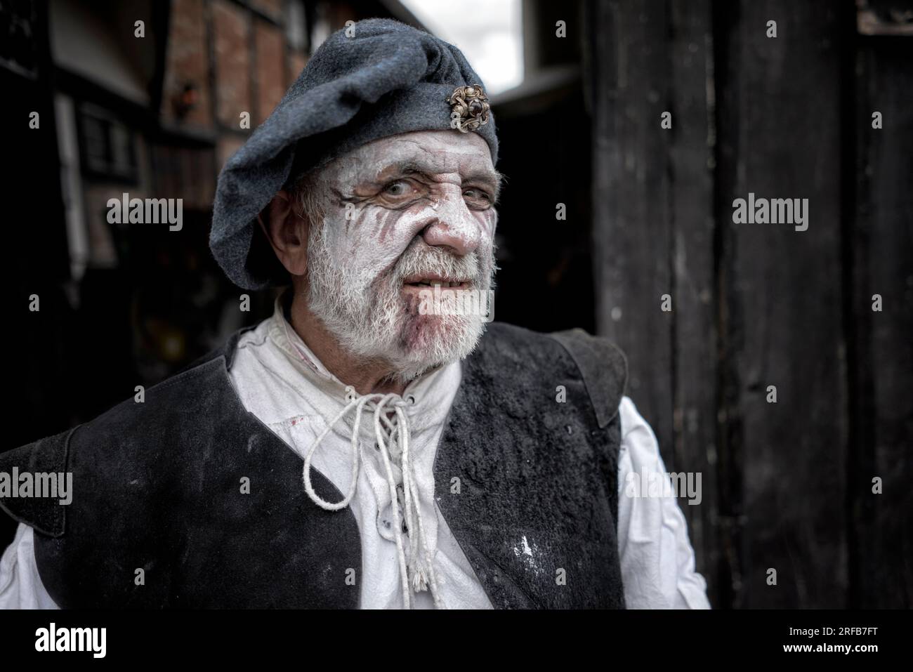 Senior man portrait dressed in traditional Tudor costume at Tudor World ...