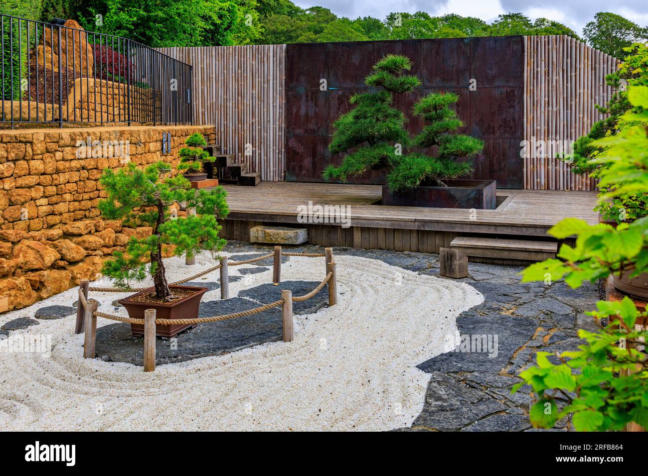 The colourful Japanese Garden with many different sizes of bonsai trees ...