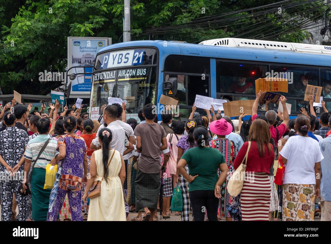 Yangon, Myanmar. 01st Aug, 2023. Family members wave around a bus ...