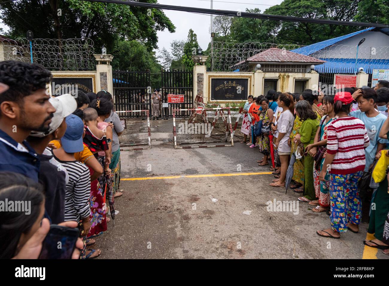 Yangon, Myanmar. 01st Aug, 2023. Family members gather in front of the ...
