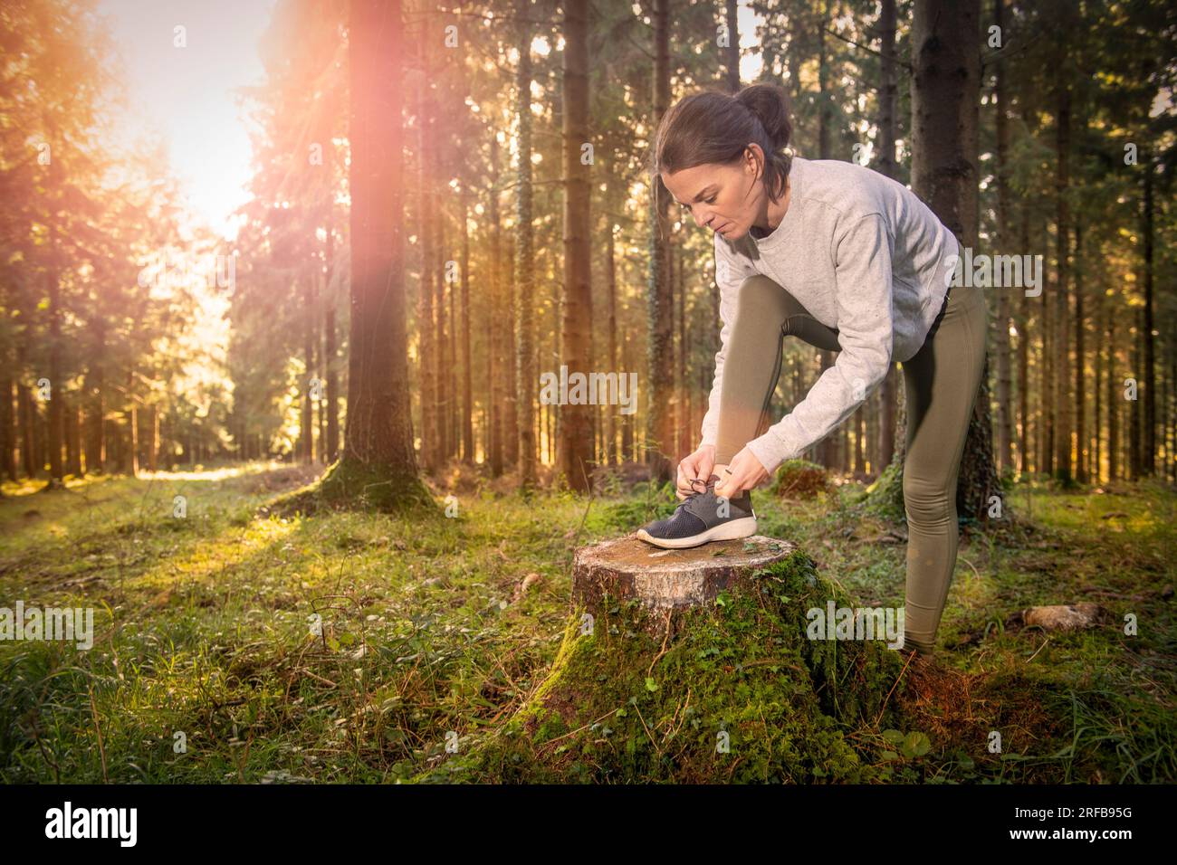 Female runner running through forest hi-res stock photography and ...