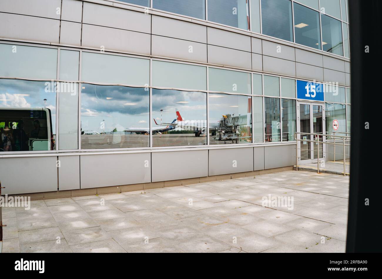 plane reflection in mirror window of airport gate Stock Photo - Alamy