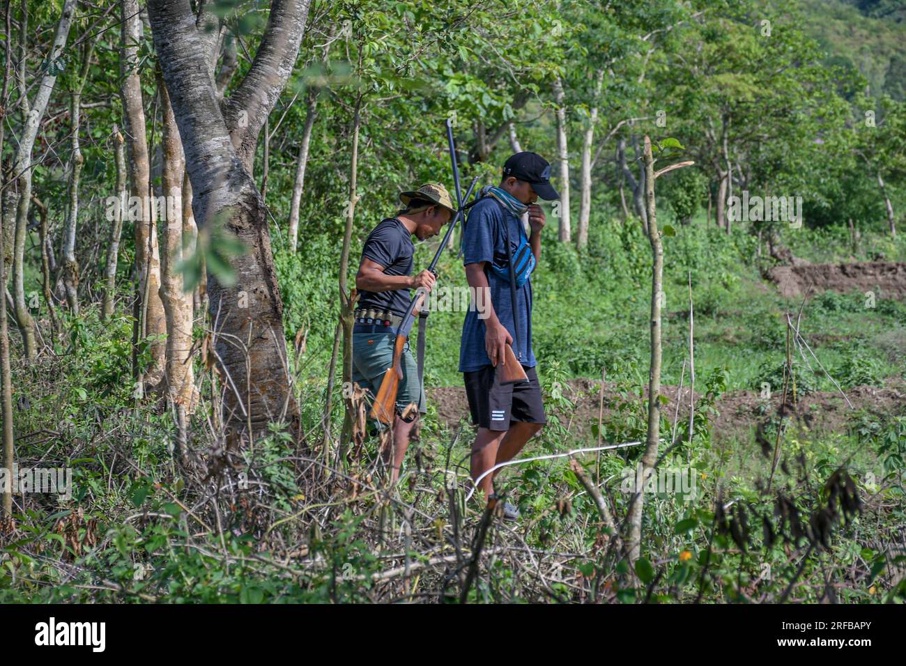 Armed Kuki men guard a village in Churachandpur district in the northeastern state of Manipur ...