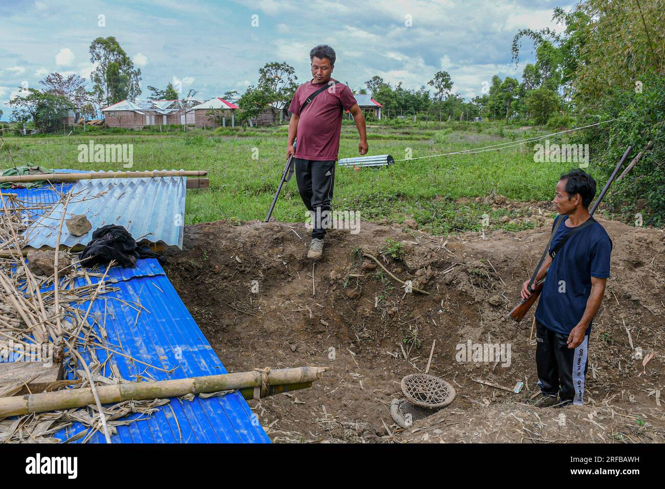 Armed Kuki men guard a village in Churachandpur district in the ...