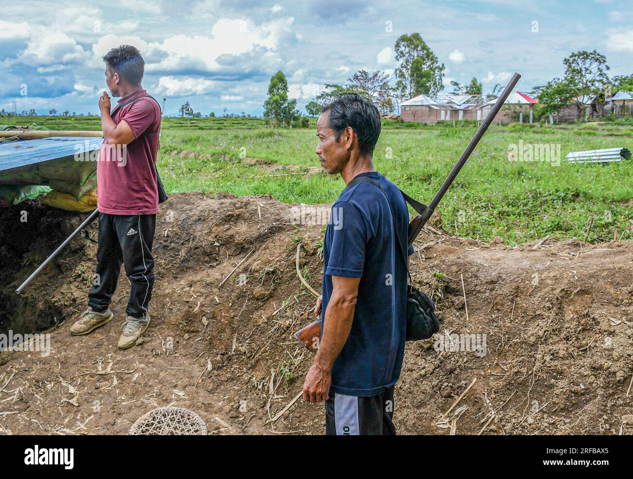 Armed Kuki men guard a village in Churachandpur district in the ...