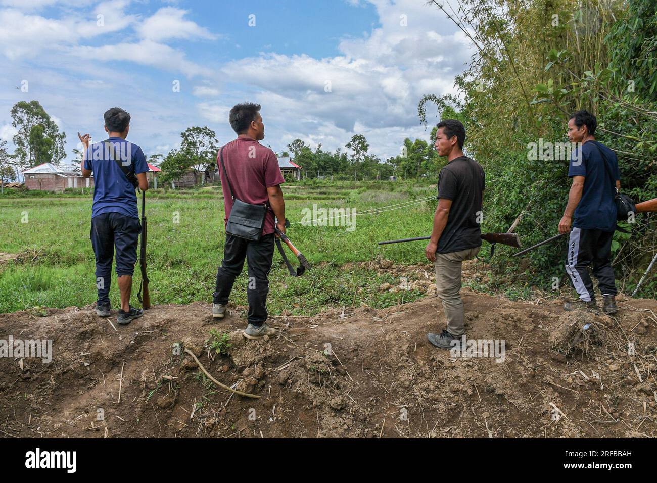 Armed Kuki men guard a village in Churachandpur district in the ...