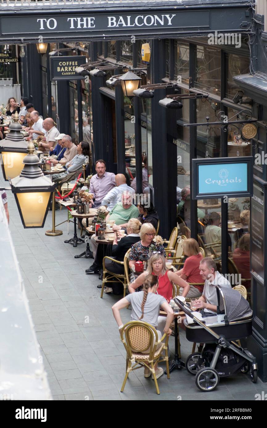 People sitting outside Coffee Barker in Castle Arcade Cardiff Wales UK ...
