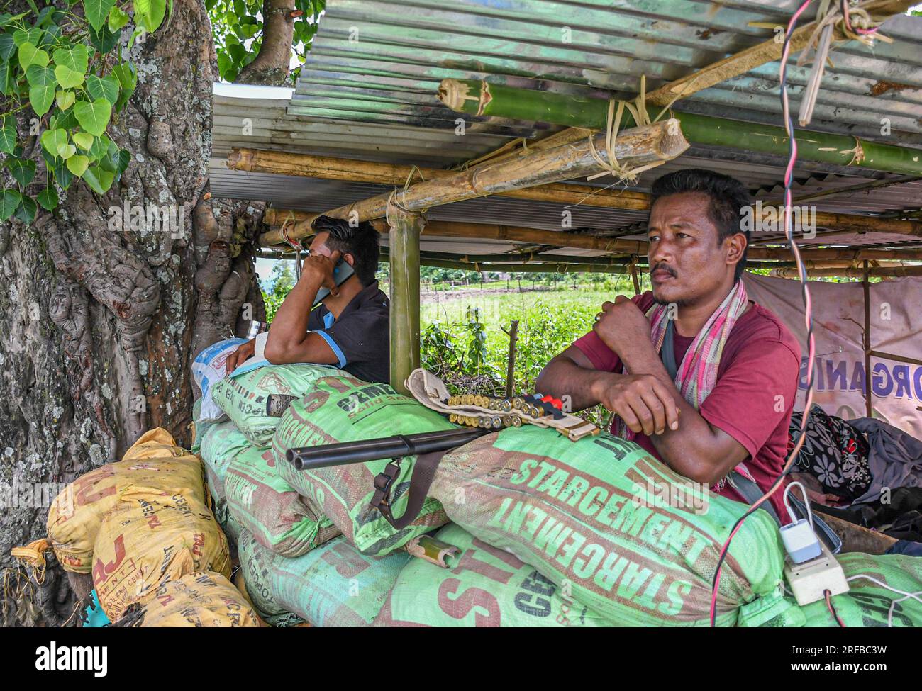 Armed Kuki men guard a village in a bunker in Churachandpur district in ...