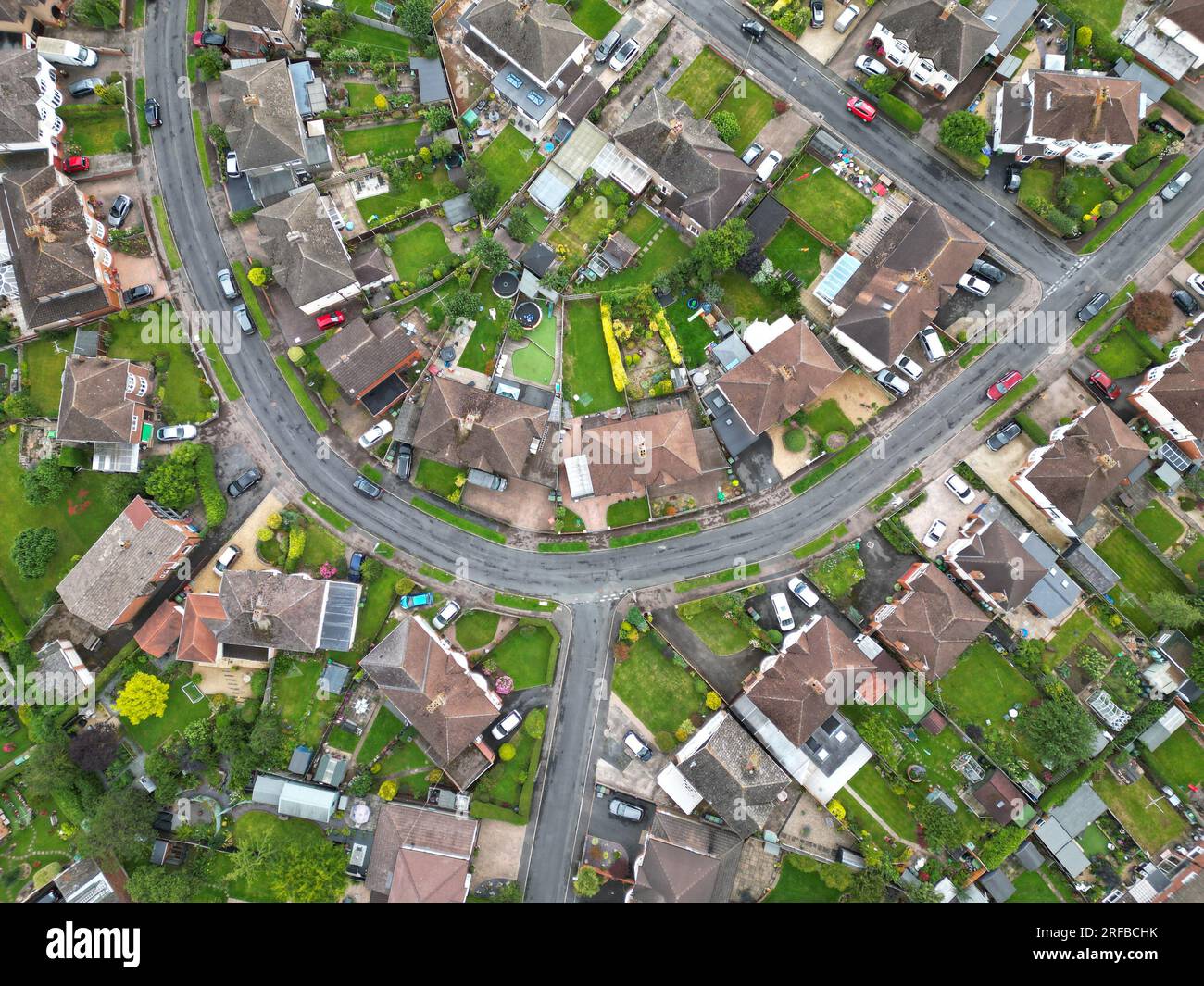 Aerial view of suburbia housing gardens and urban street planning in ...