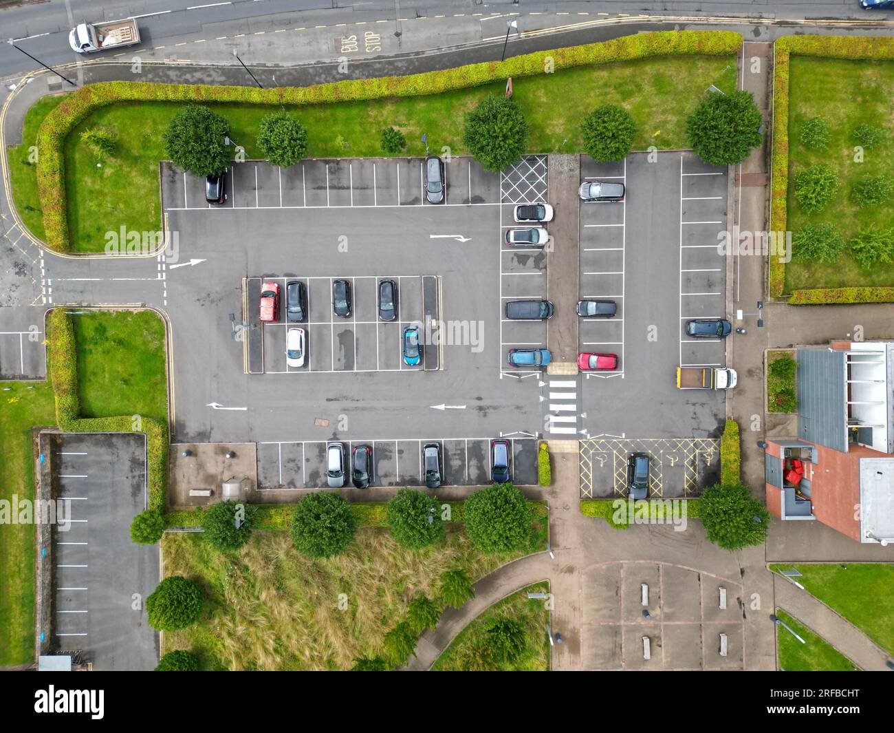 Aerial view of car park and parking spaces at a local college in UK ...