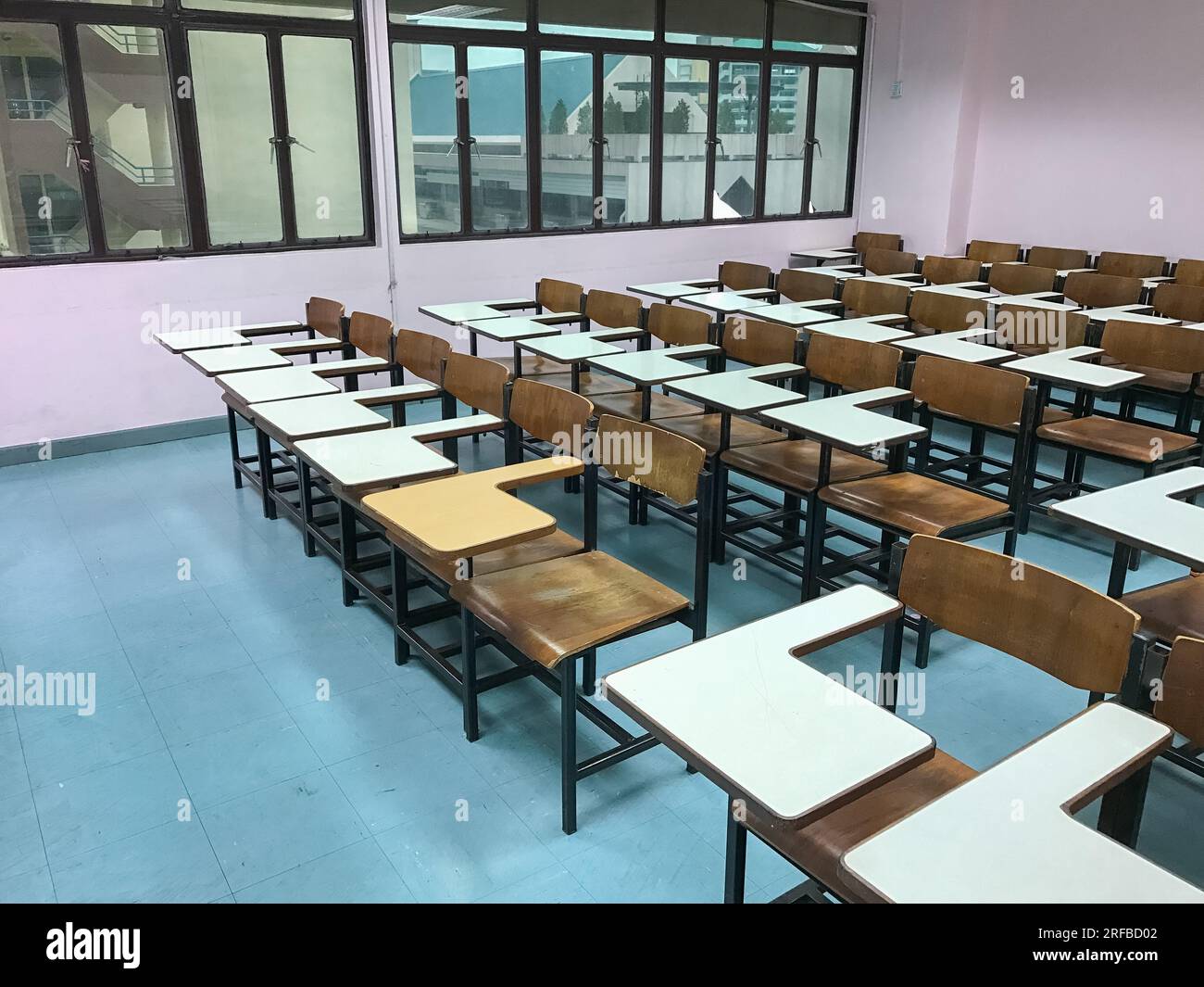Wooden chairs in the classroom background Stock Photo - Alamy