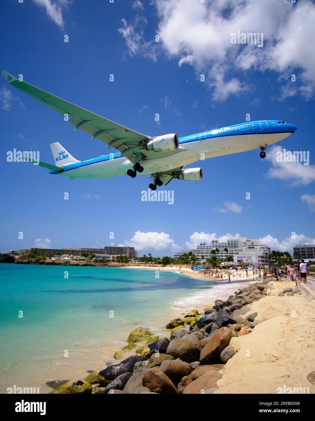 A plane landing at the island of Sint Maarten, just meters over the ...