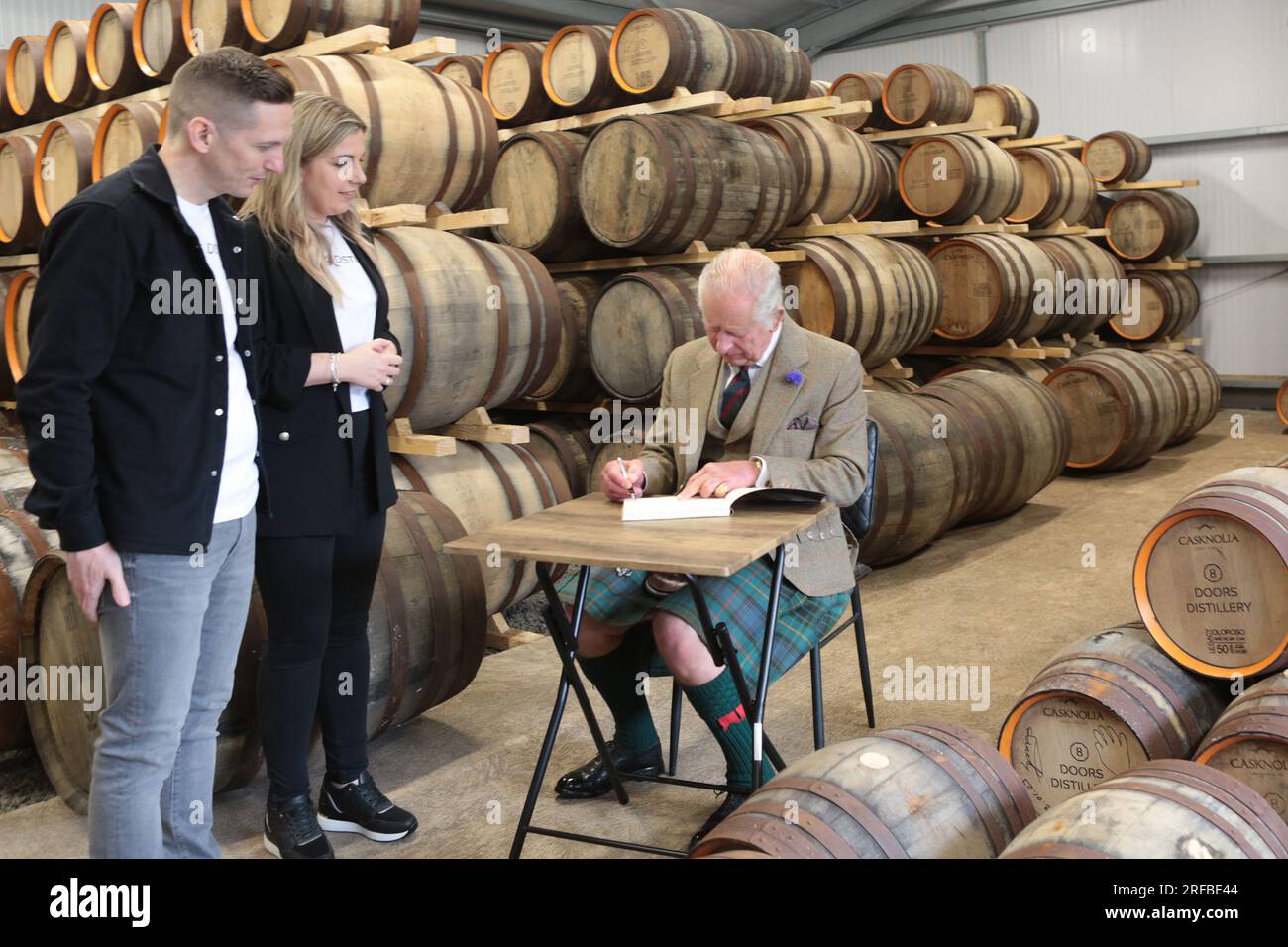 King Charles III, with the distillery owners Kerry and Derek Campbell ...