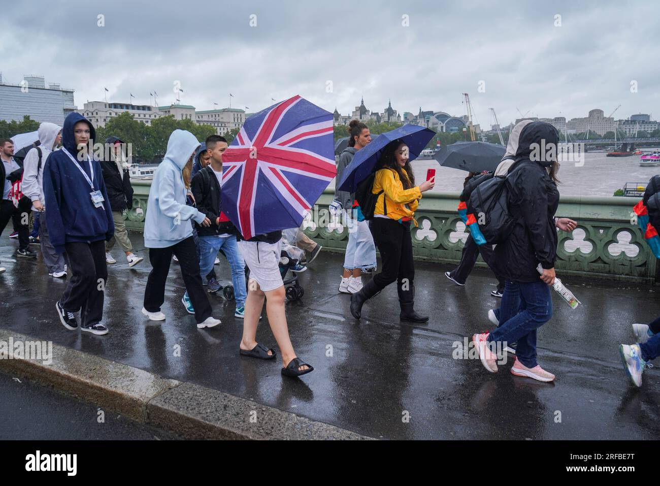 London UK. 2 August 2023 Pedestrians on Westminster bridge brave the ...
