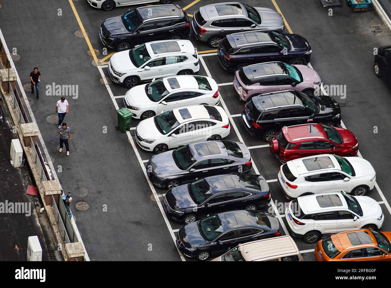 Pedestrian walk past cars hi-res stock photography and images - Alamy