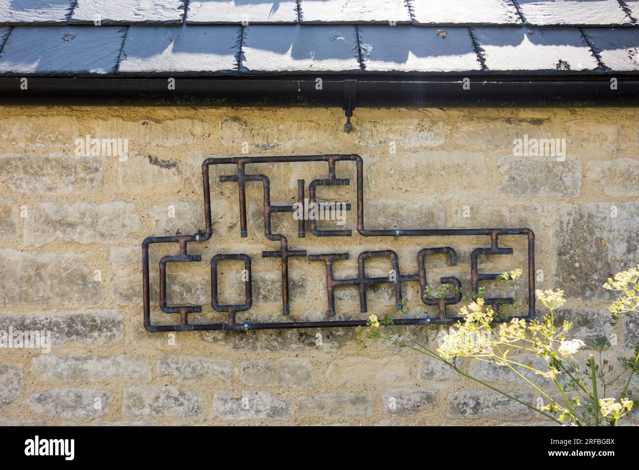 The Cottage sign made with welded copper pipes, Gloucestershire, UK ...