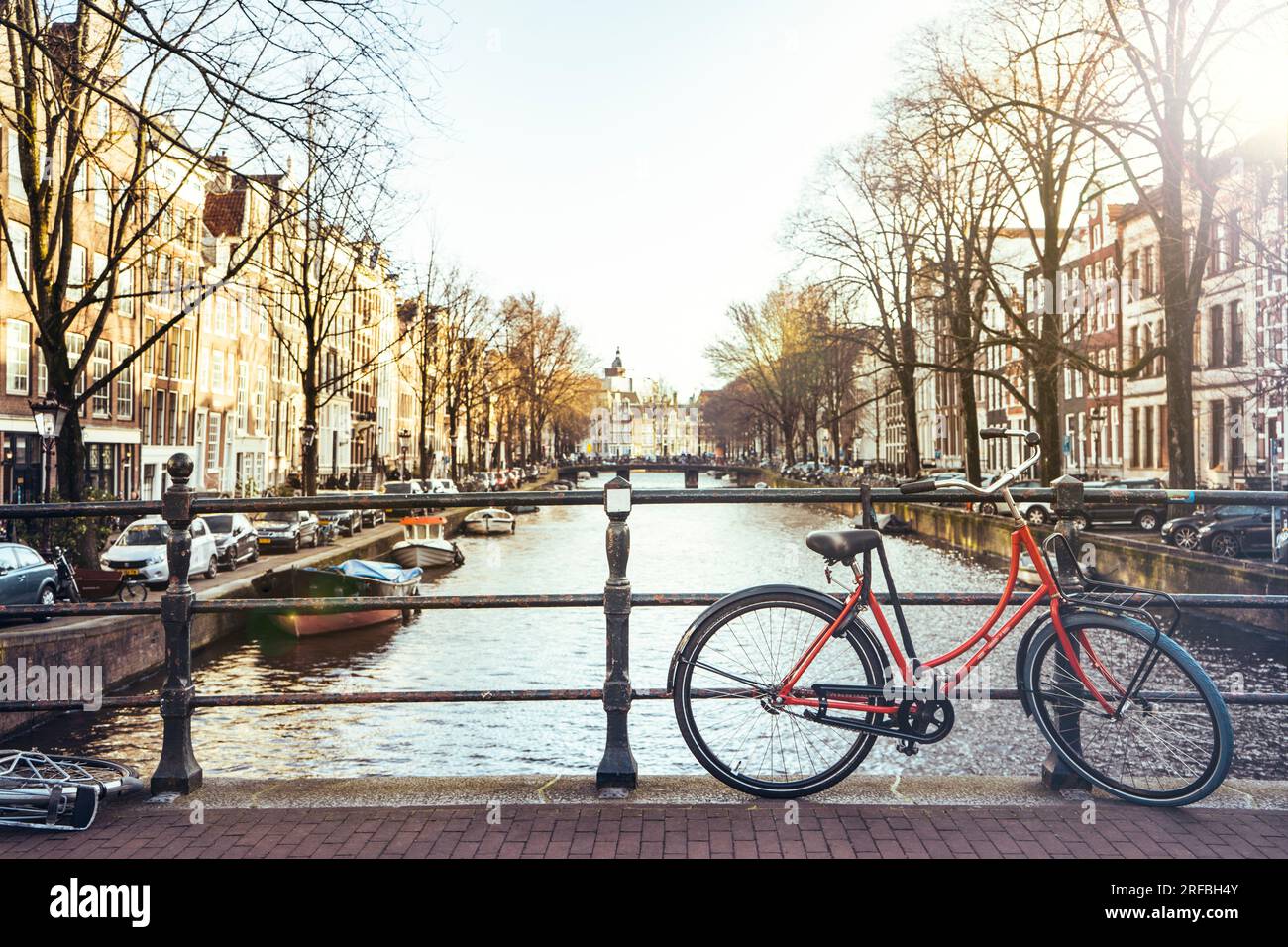 Bike over channel in Amsterdam city Stock Photo - Alamy